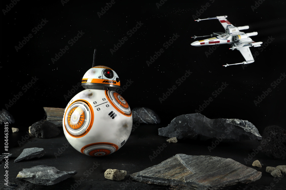 a droid robot character in the Star Wars movie name BB-8 (or Beebee-Ate) display on stone table ...