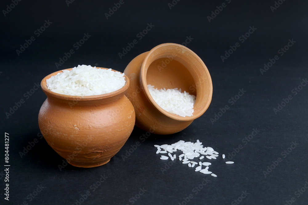 rice grains in the clay pot. traditional mud pot vessel to preserve or ...