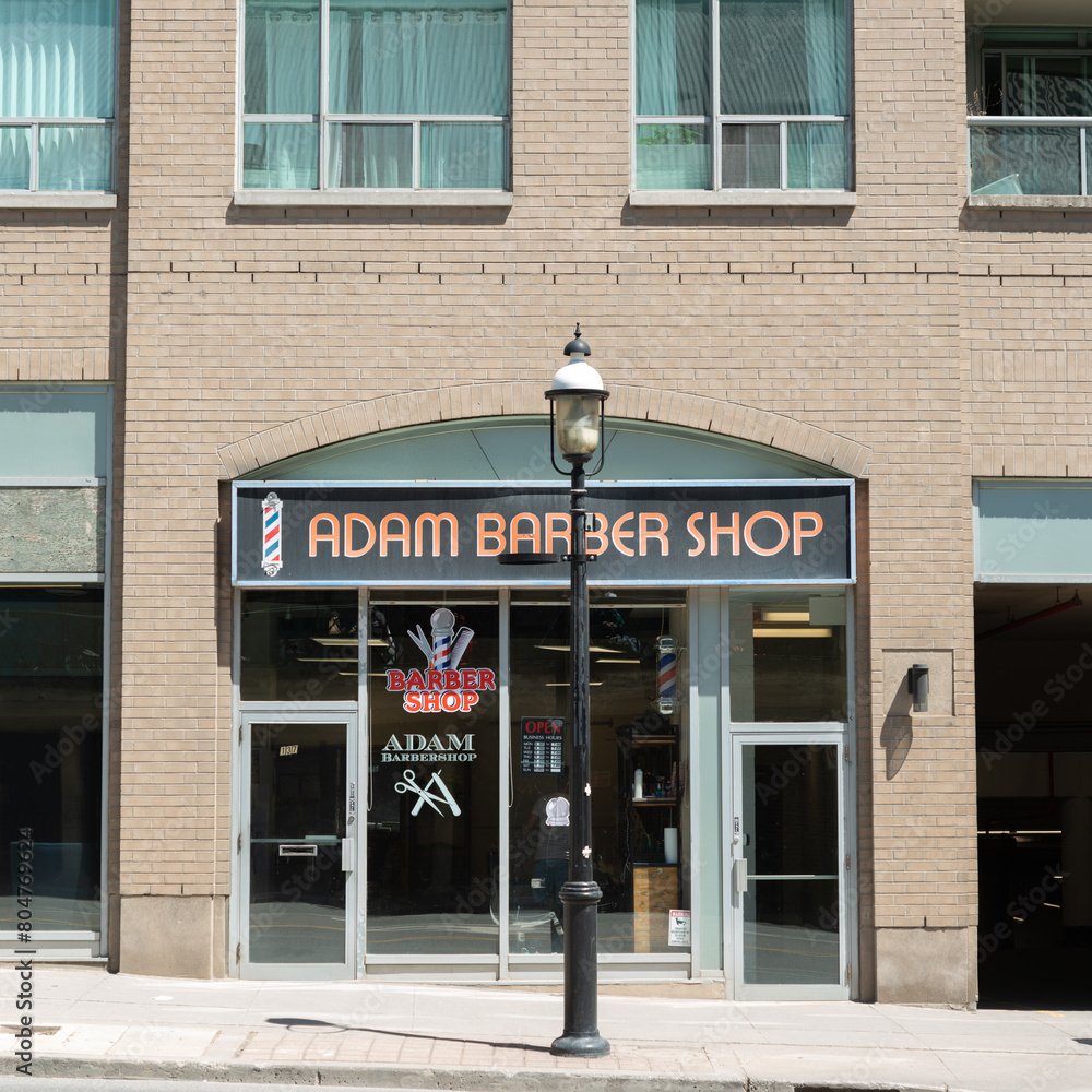 exterior building facade entrance and sign of Adam Barber Shop located ...