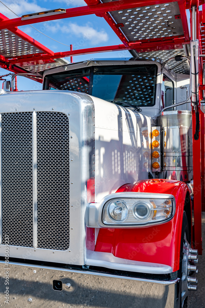 Front view of the bright red big rig semi-truck with car hauler semi ...