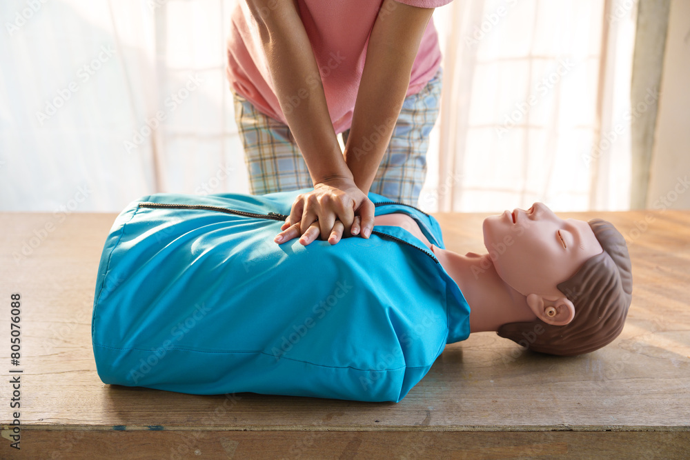 Close-up of young Asian female hands performing cardiopulmonary ...