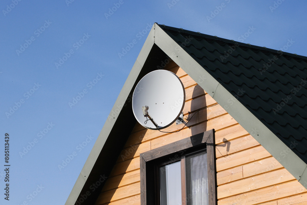Tile roof antenna background. TV satelite dish old house roof ...