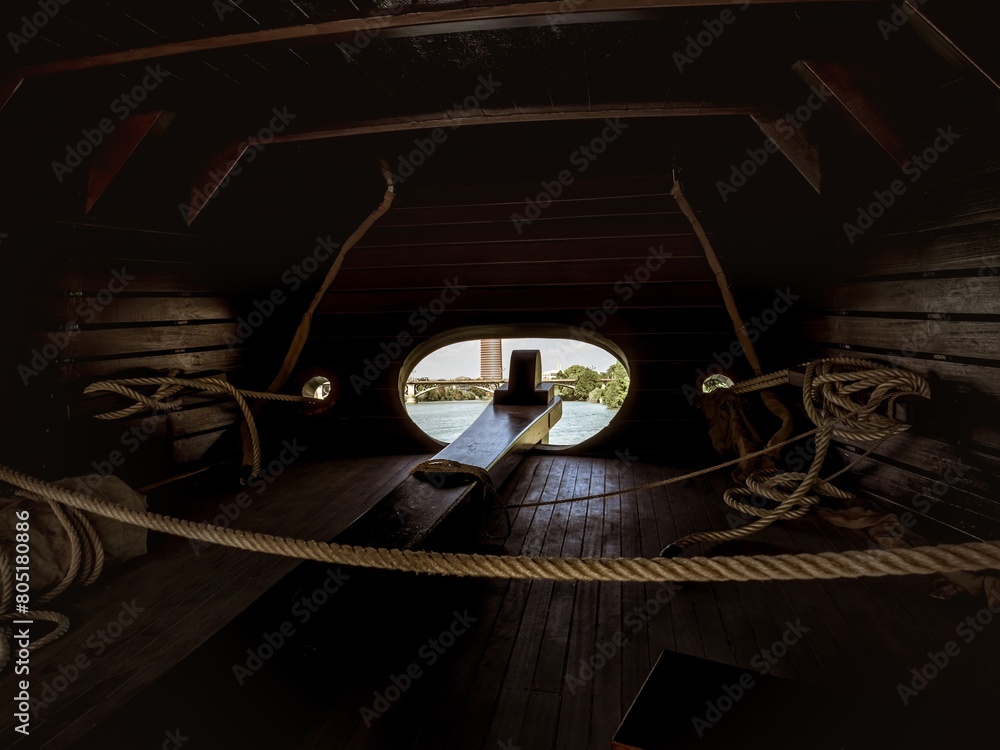 Interior of the stern area with the rudder for steering in the wooden ...