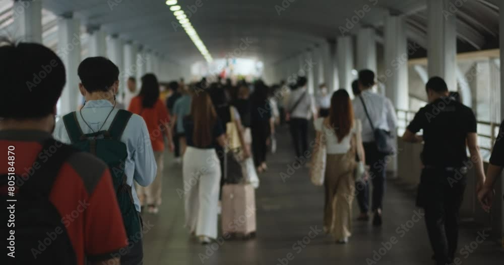 Crowd of people in metropolis city overhead passage walkway activity ...