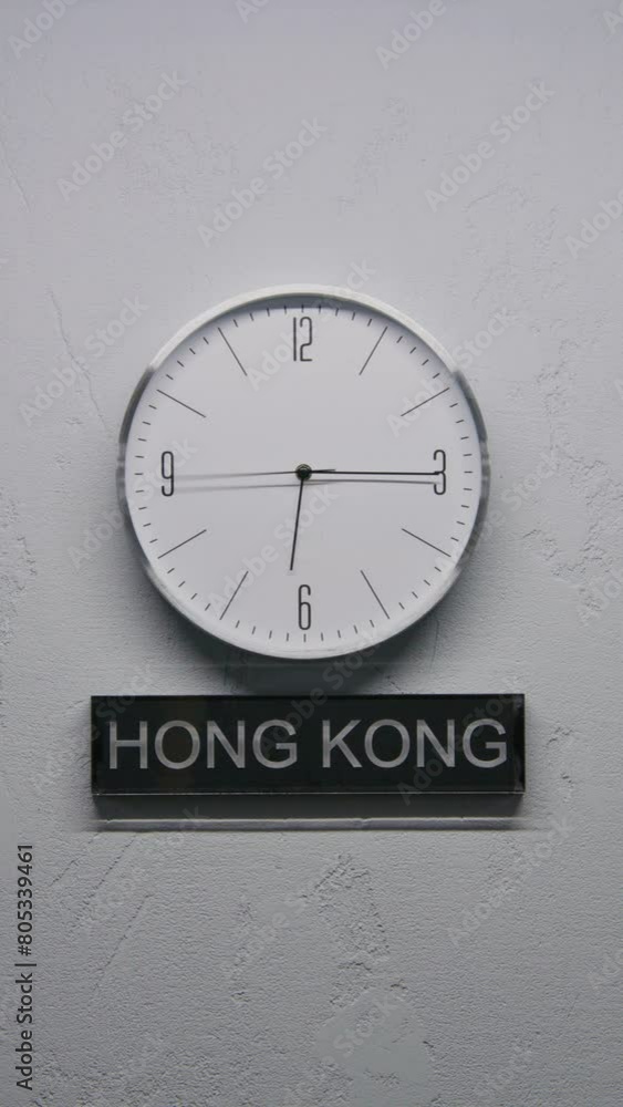 Static shot of walking wall clocks in office with modern design. White ...