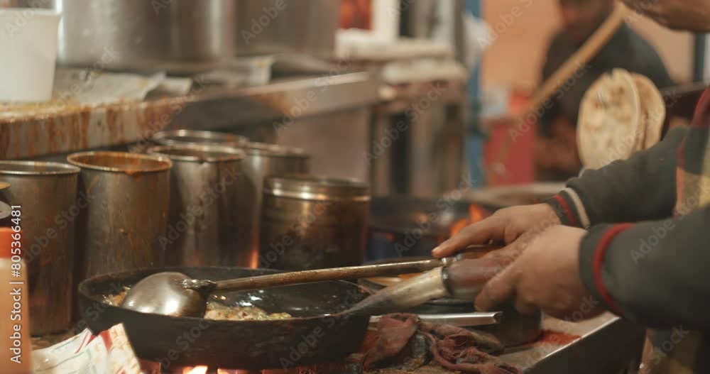 Man cooking street food Biryani on a busy street. Slow motion Biryani ...
