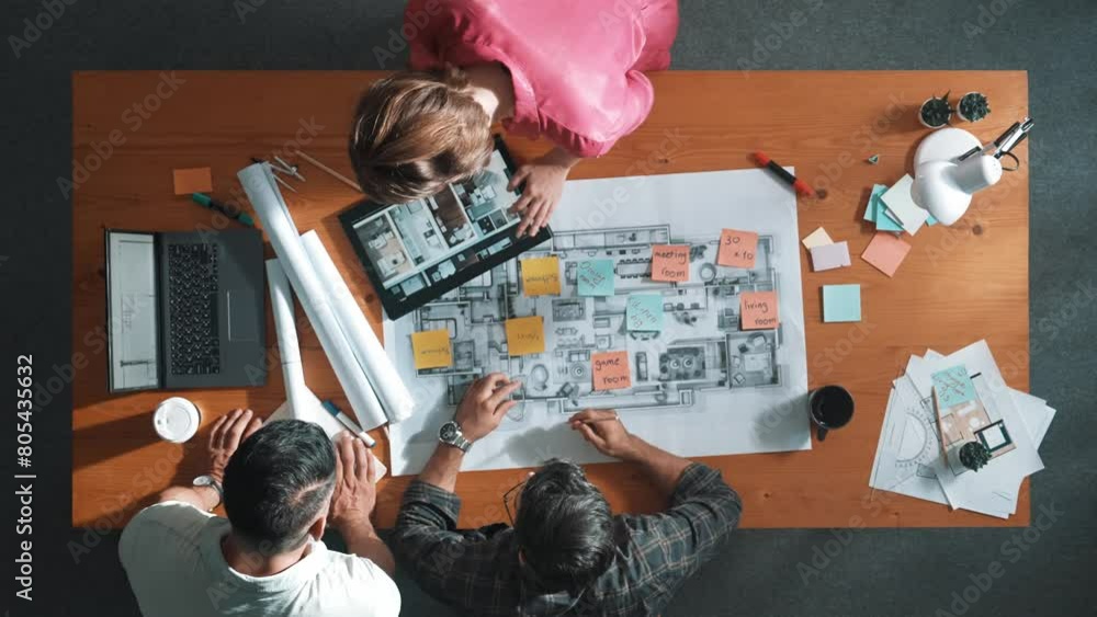 Top down aerial view of civil engineer hold project plan while design ...