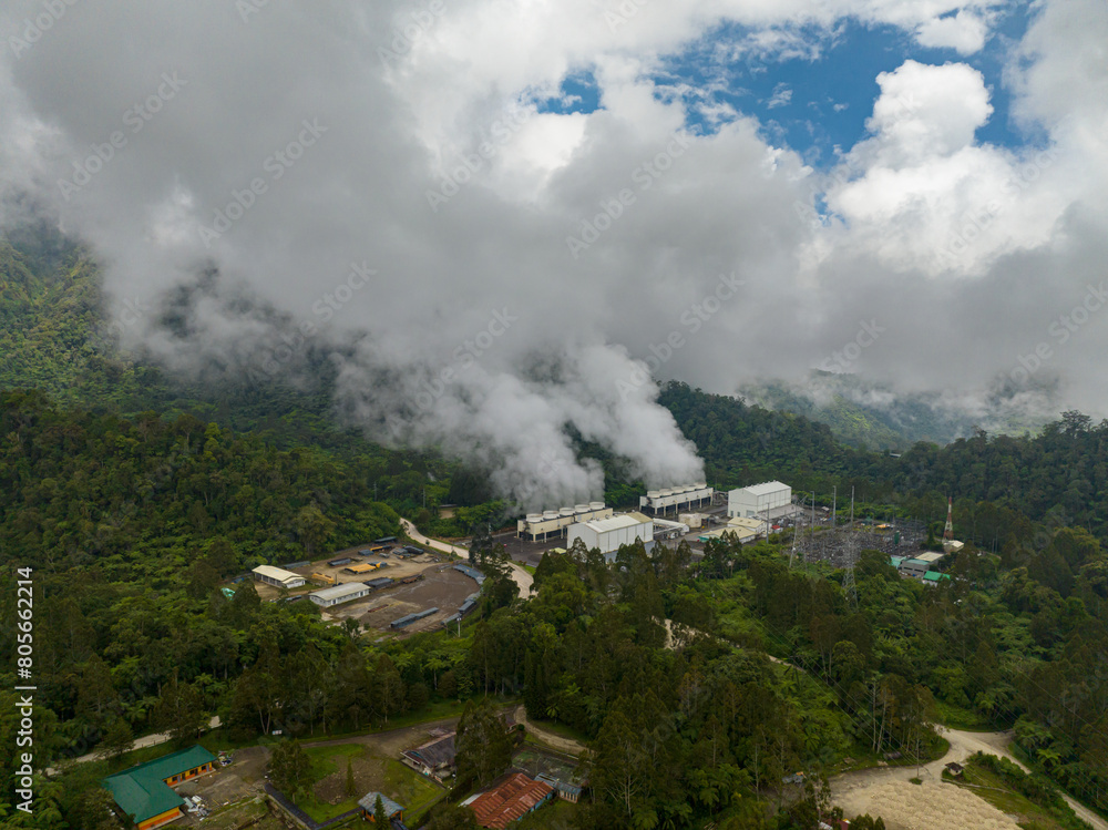 Aerial view of Geothermal station with steam and pipes. Geothermal ...