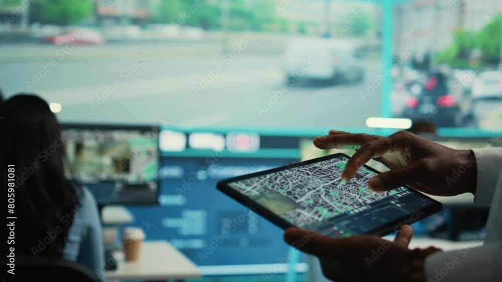 Manager tracking a delivery car by using satellite map for navigating ...