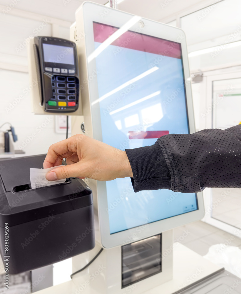 Customer pays his purchase at the supermarket,self checkout systems in ...