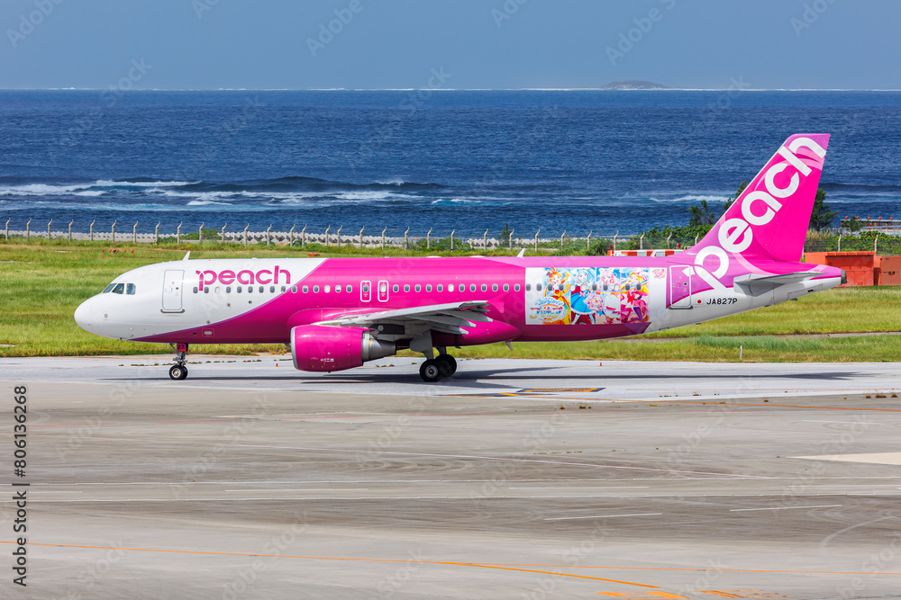 Peach Airbus A320 airplane at Okinawa Naha Airport in Japan Soaring Sky ...