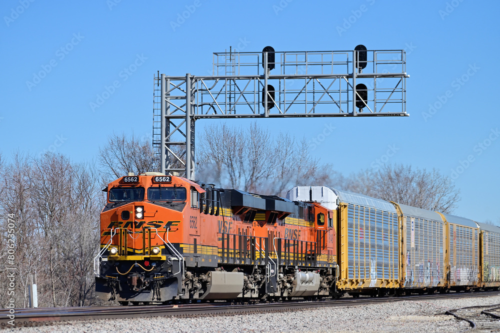 Two locomotives lead a Burlington Northern Santa Fe auto rack train ...