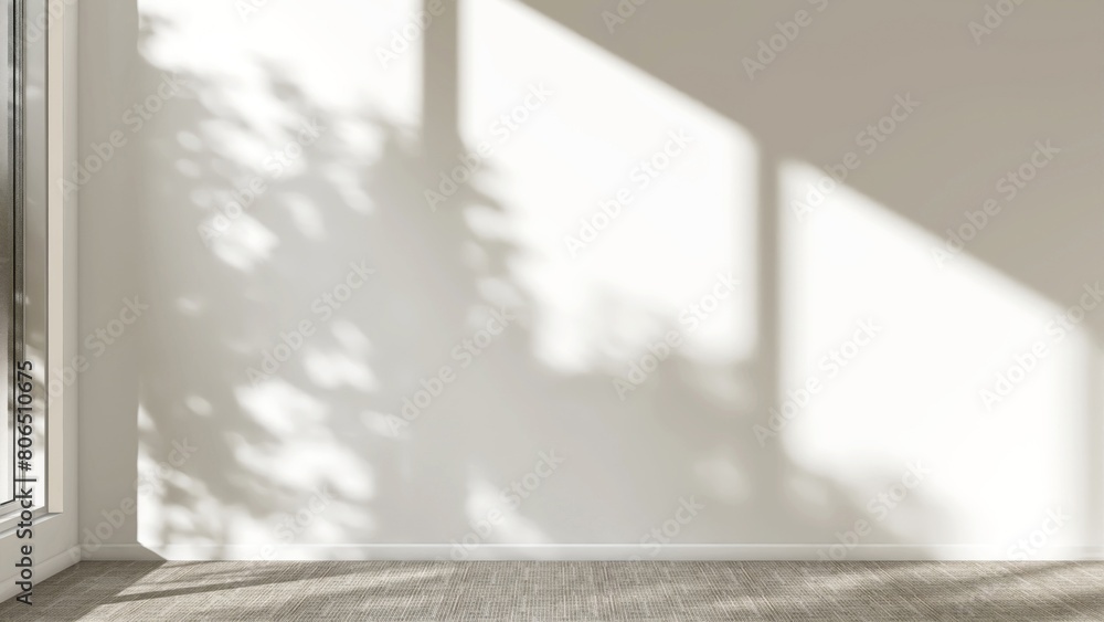 Cream wall room in sunlight from window with tree shadow on white ...
