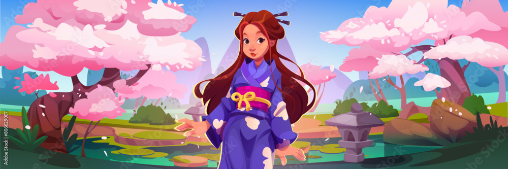 Young woman in traditional japanese kimono standing in park with pink ...
