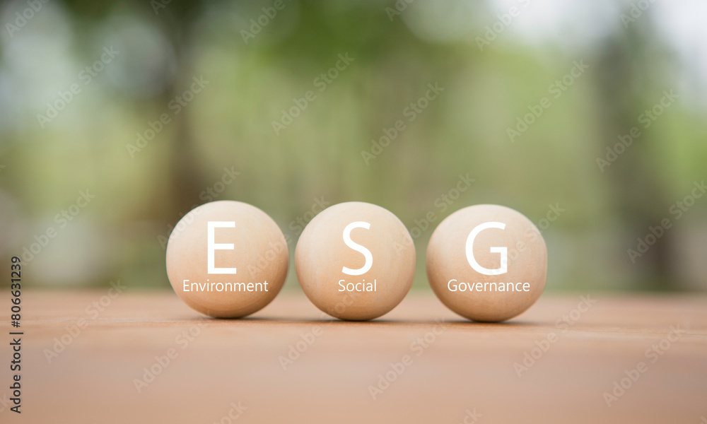 ESG on round wooden blocks. ESG concept for businesses and ...