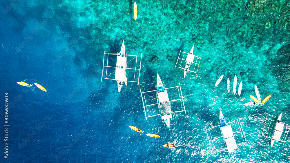 Aerial Top View of Bangka Boats as sand beach by a crystal clear water ...