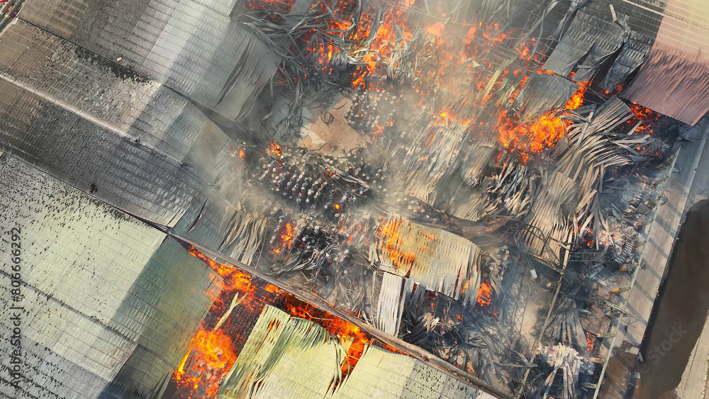 Aerial perspective unveils a harrowing scene, a raging inferno engulfs ...