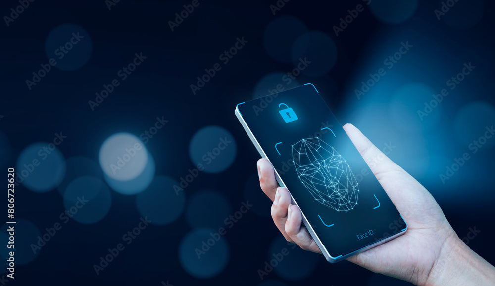 Asian using mobile smartphone scanning face ID to unlock phone security access with facial ...