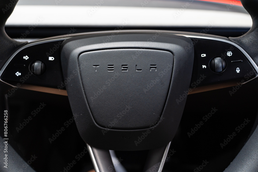 Tesla logo on steering wheel. Tesla model 3 highland. Interior of a ...