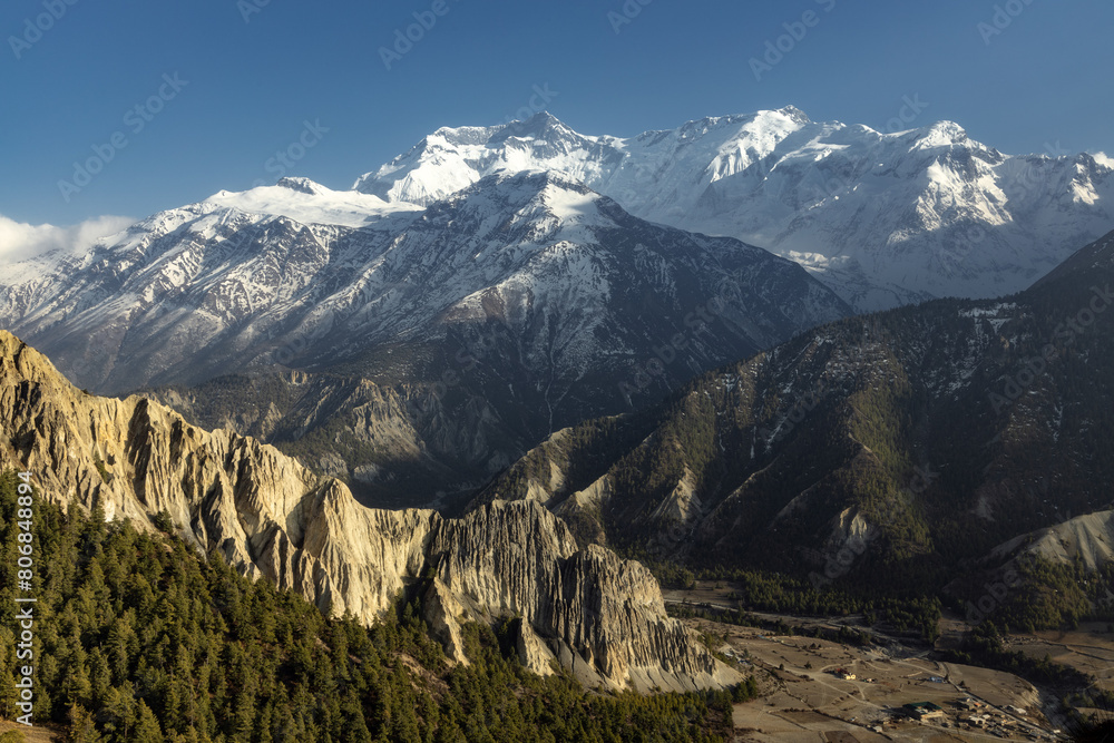 Snow covered peaks and scenic landscape in Himalayan mountains range valley of the Annapurna ...
