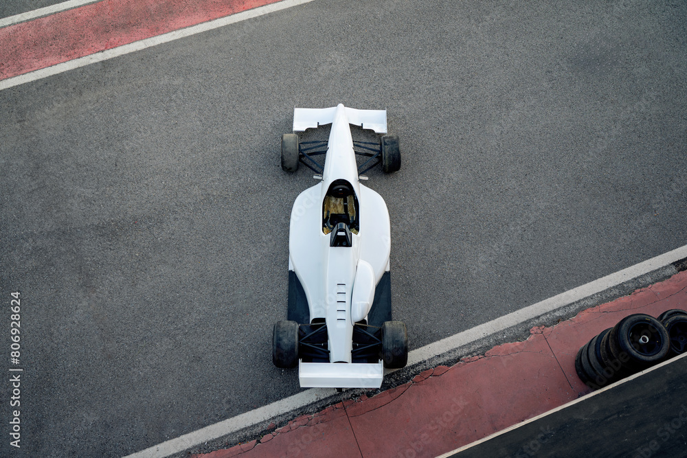 Formula performance race car parked on track, top view and asphalt ...