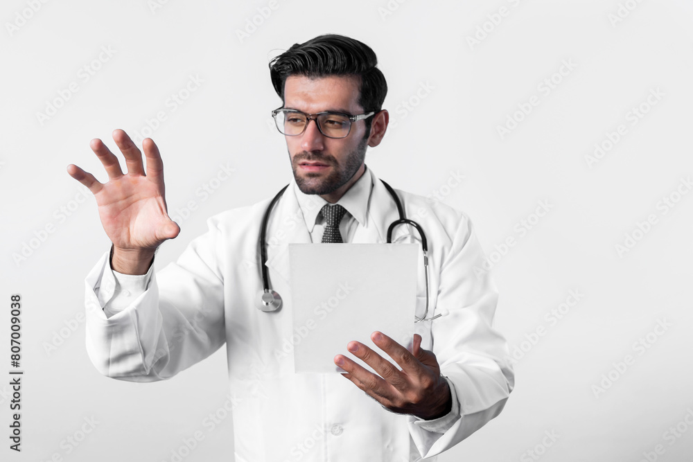 Caucasian smart doctor pointing finger while standing at white ...