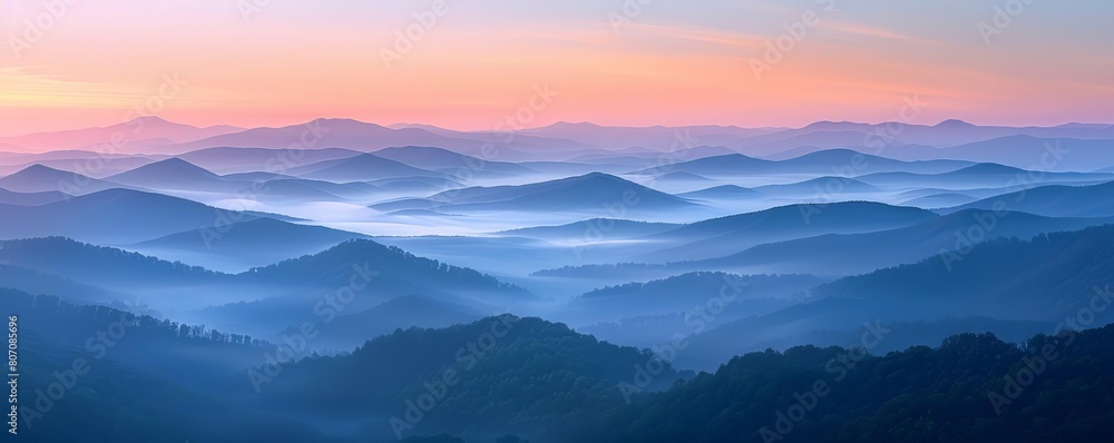 Misty hills at sunrise, layers of hills visible in the soft morning ...