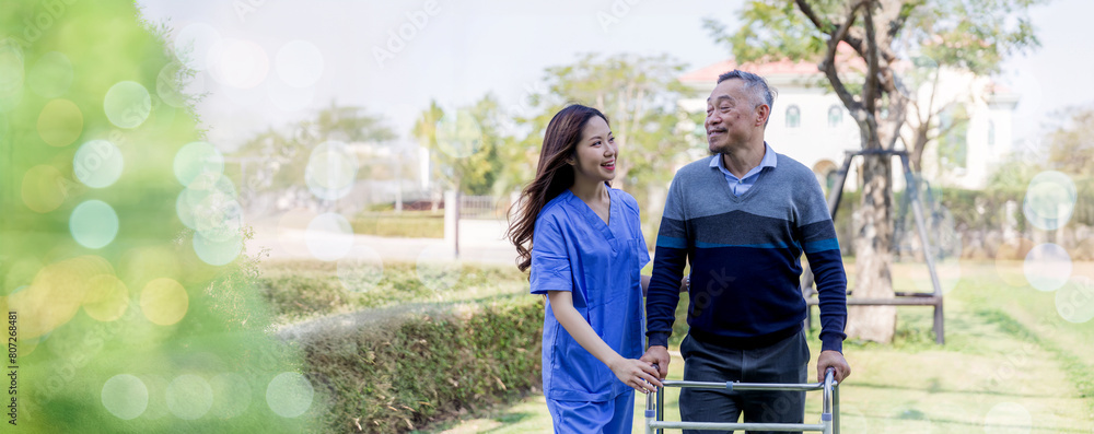 doctor or nurse helping Senior man to walk at nursing home with walker ...