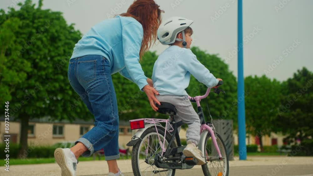 Mother teaches ride bike little daughter child. daughter kid with mom ...