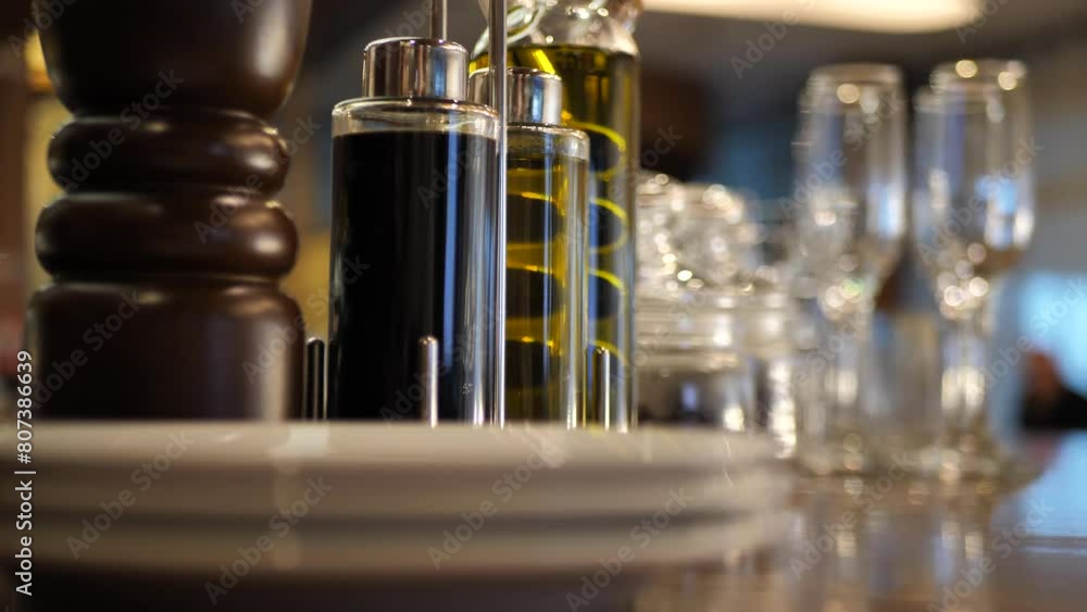 containers for vegetable oil and vinegar on the bar counter before ...