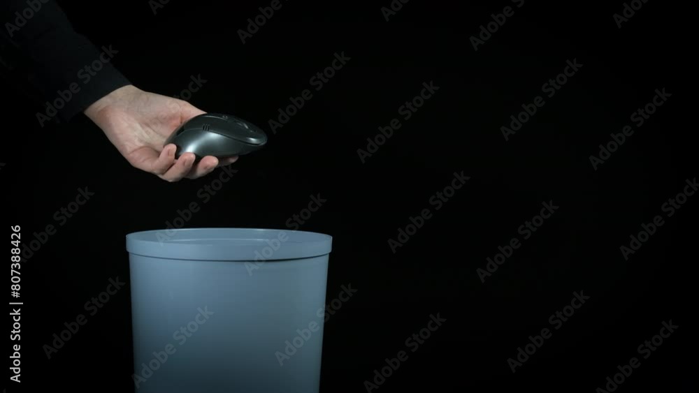 Female throw old electronic devices in trash. A view of female throw ...