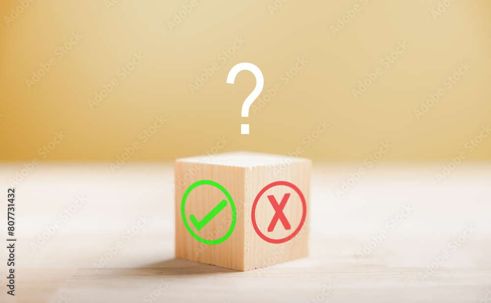 Wooden block illustrates choice with green check mark and red x ...