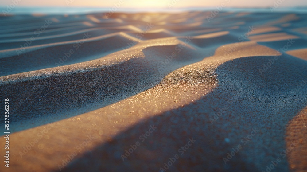 A high-resolution image of a close-up sand dune with the sun ...