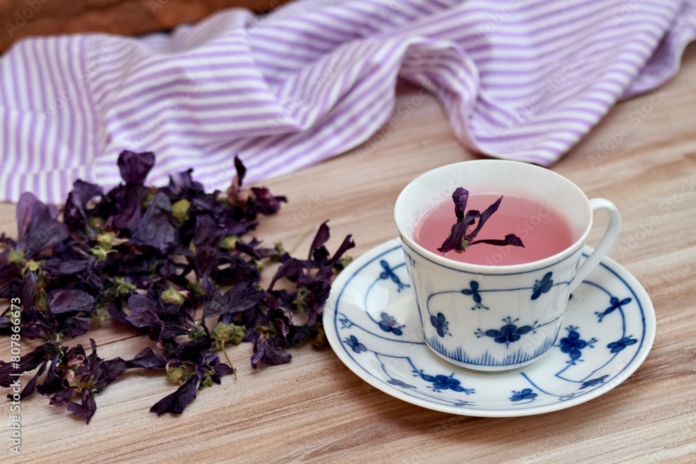 Cup of herbal tea from dried flowers of Wild mallow, lat. Malva ...