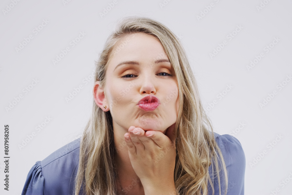Studio, portrait and woman with kiss, comic and goofy expression with ...