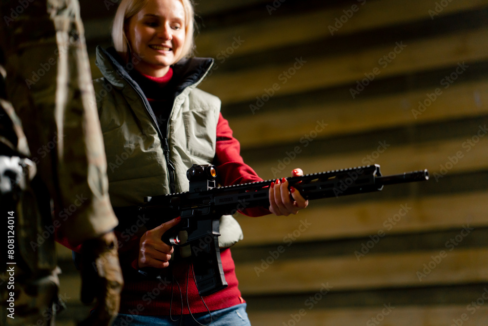 At a professional shooting range military trainer teaches a cheap girl ...