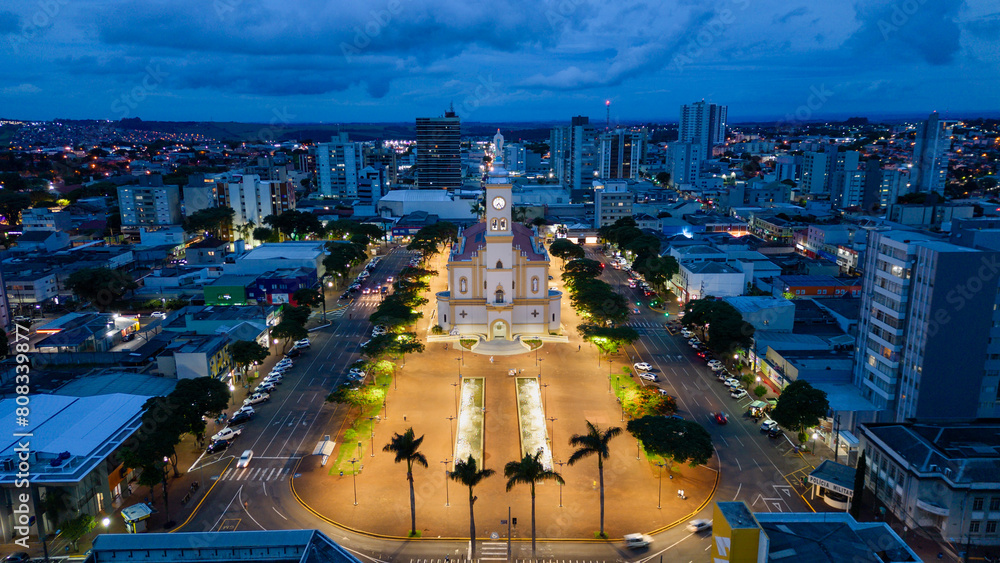 City of Apucarana during the early evening with the yellow lights of ...