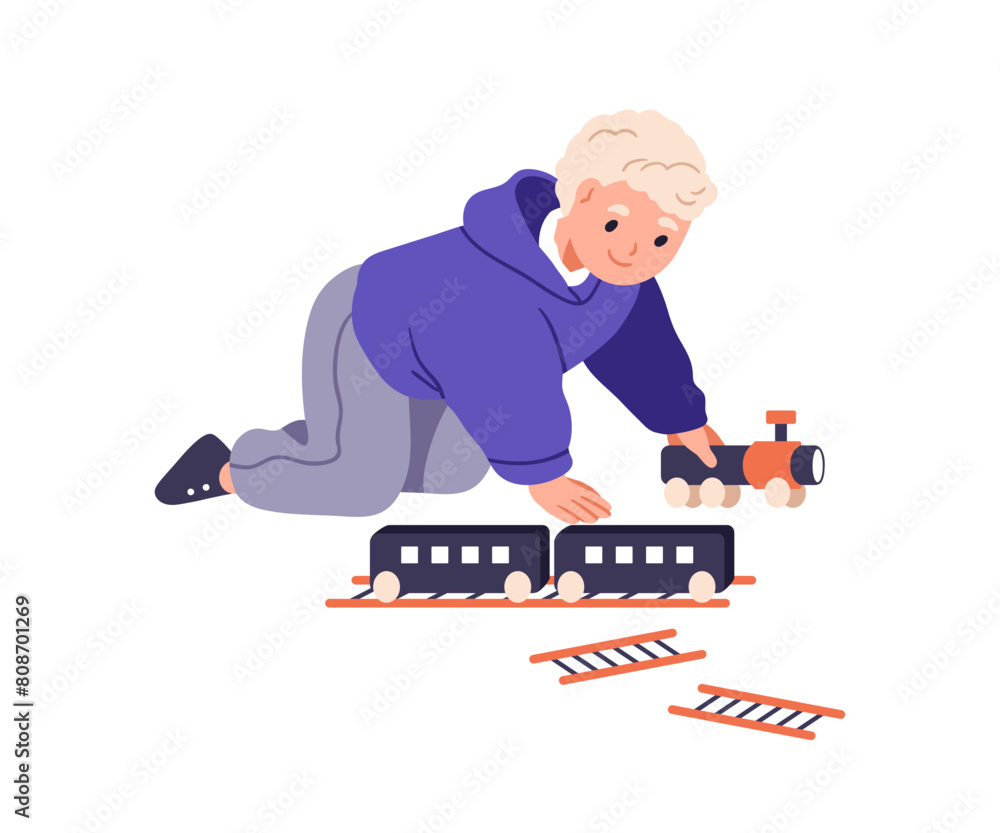 Kid playing with toy train. Toddler boy, railway game. Happy ...