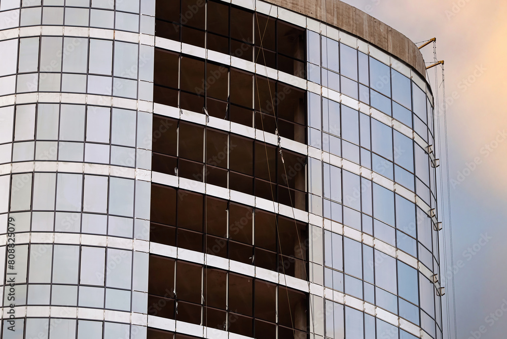Facade construction with structural glazing. Installation of glass ...