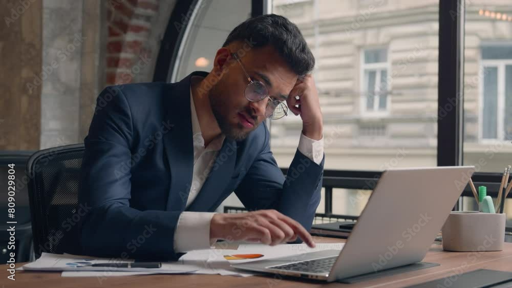 Arabian Indian tired sad businessman manager employee bored at desktop ...