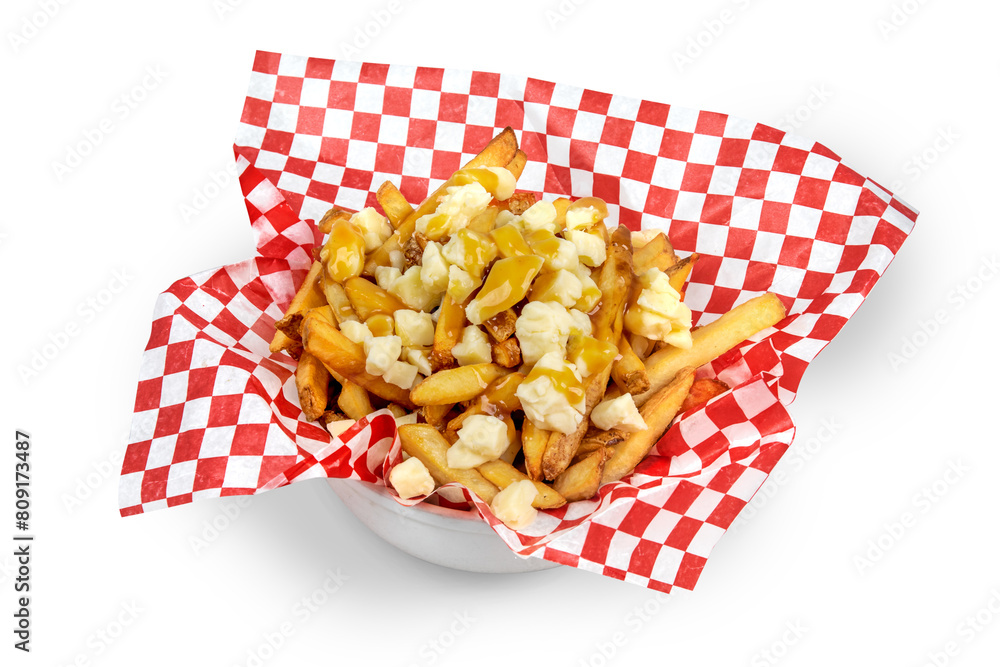 French fries, cheese curds and gravy poutine on a red checked paper ...