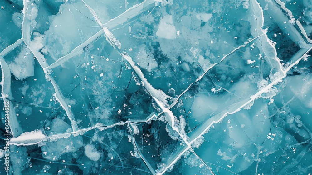 Jagged cracks dissect the surface of blue ice, creating a dramatic ...