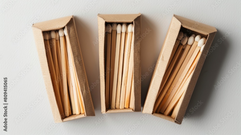 Matches stored in matchboxes Three open cardboard matchboxes packed ...