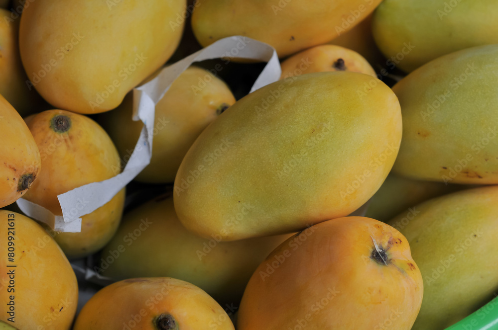A mango is an edible stone fruit produced by the tropical tree ...