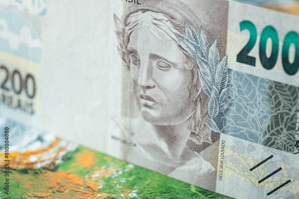 Brazilian money, 200 reais banknote on world background, Brazilian ...