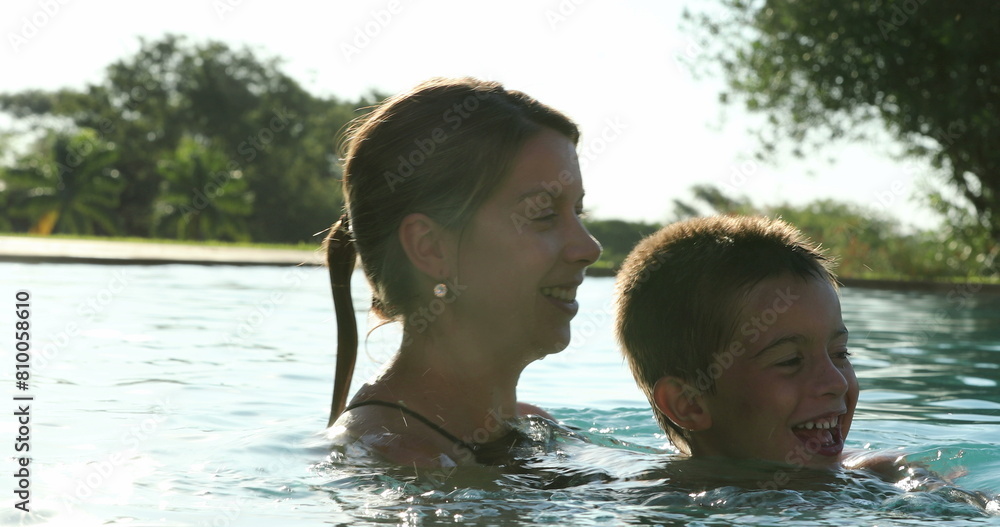 Mother and child at the swimming pool mom embracing son at the pool ...