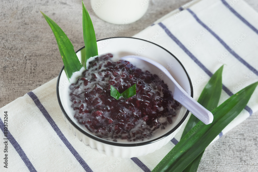 Black sticky rice porridge, a typical Indonesian dessert. Black sticky ...