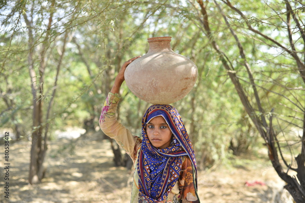 Tharparkar Sindh, Pakistan - May, 2024: Thar Woman Mitti water pot ...