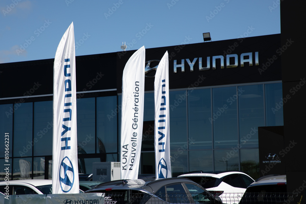 Hyundai facade Dealership text sign and logo of station store and car ...