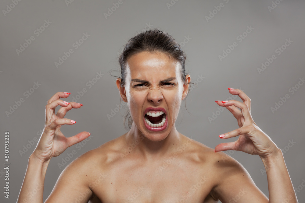 Furious young woman screaming with rage, depicting strong emotions and ...